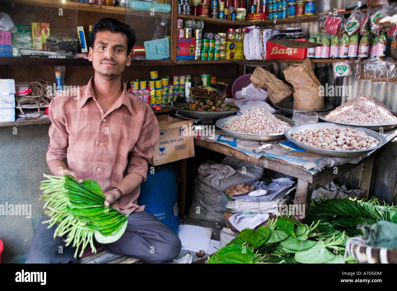 A small shop owner shows his betel leaves that are for sale Dhaka ...