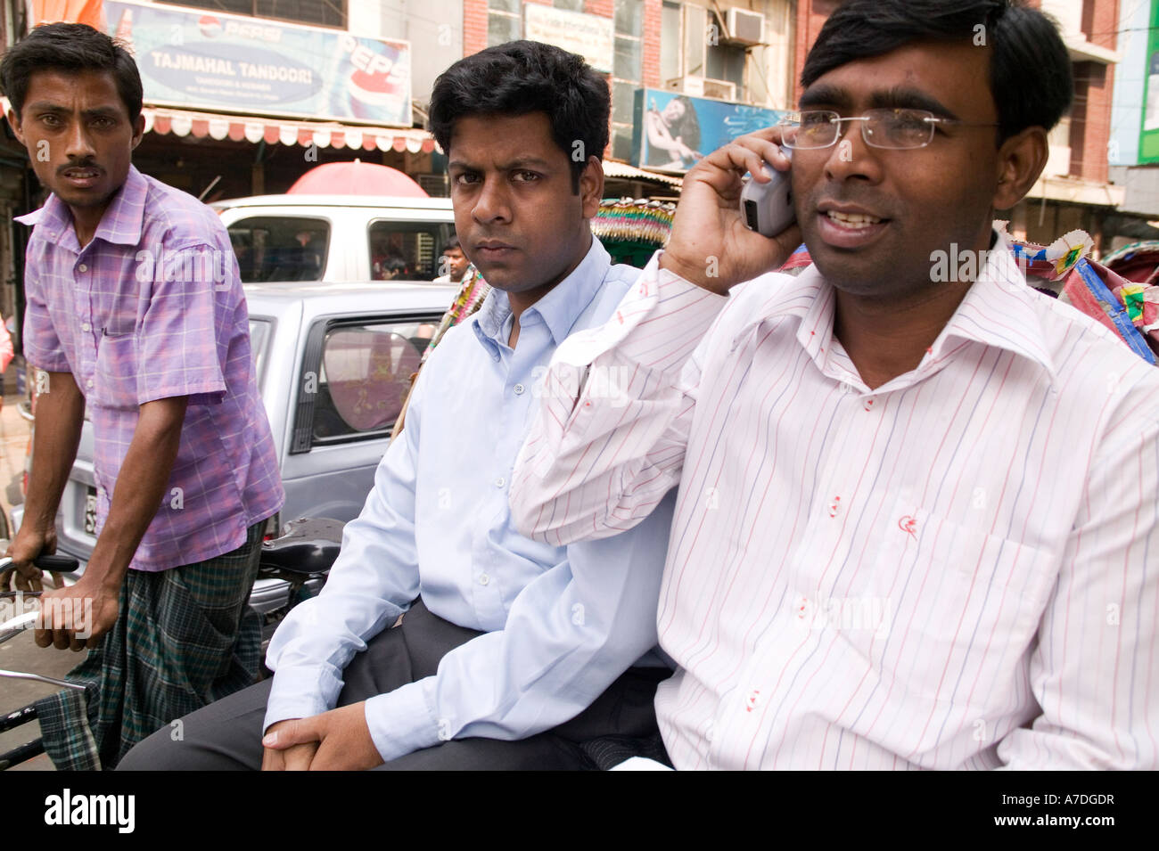 A man in a rickshaw talks on his mobile phone Dhaka Bangladesh Stock ...