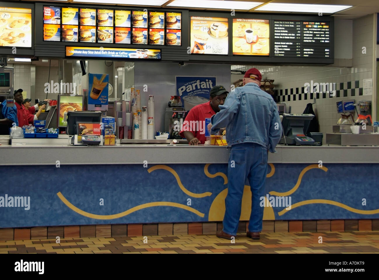 Patrons at McDonald s fast food restaurant stand in line to place an ...