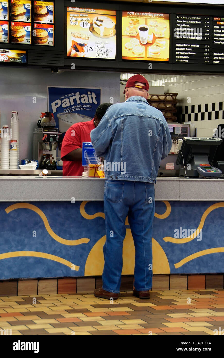 Patrons at McDonald s fast food restaurant stand in line to place an ...