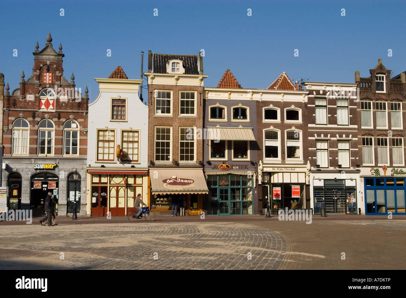 Row of shops including Cheese shop and Subway chain restaurant on markt ...