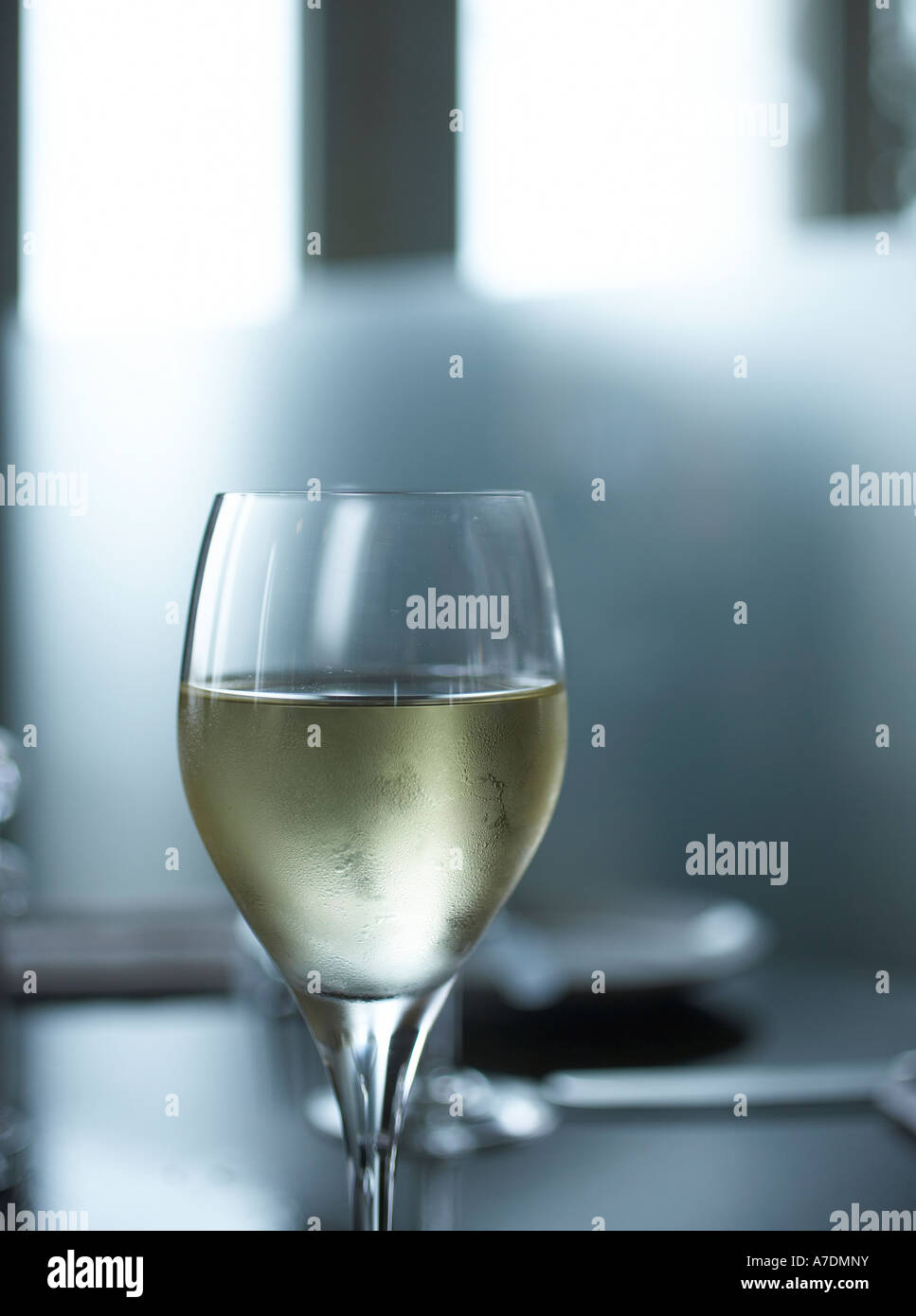 White wine in glass portrait Stock Photo - Alamy