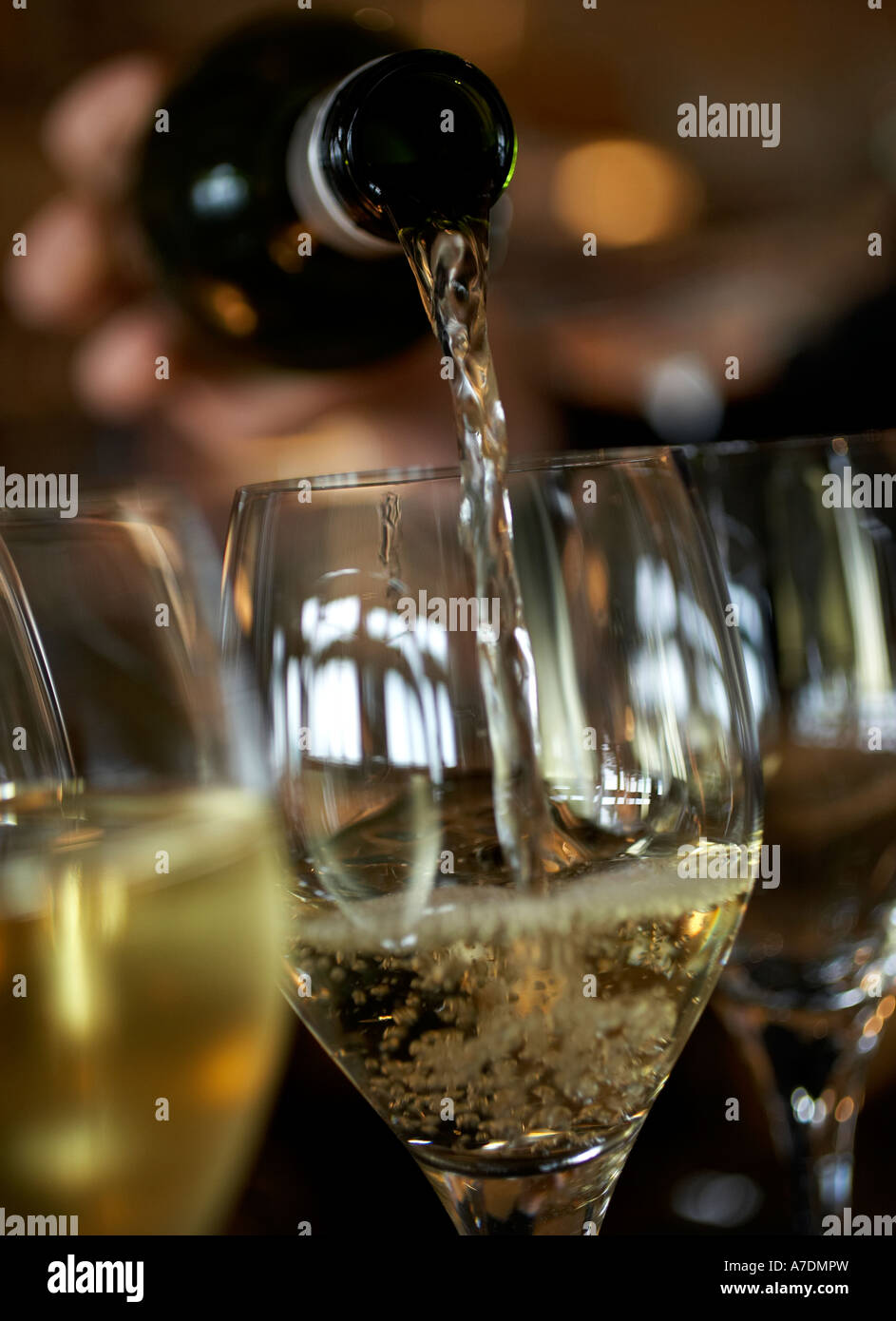 White wine pouring Stock Photo - Alamy