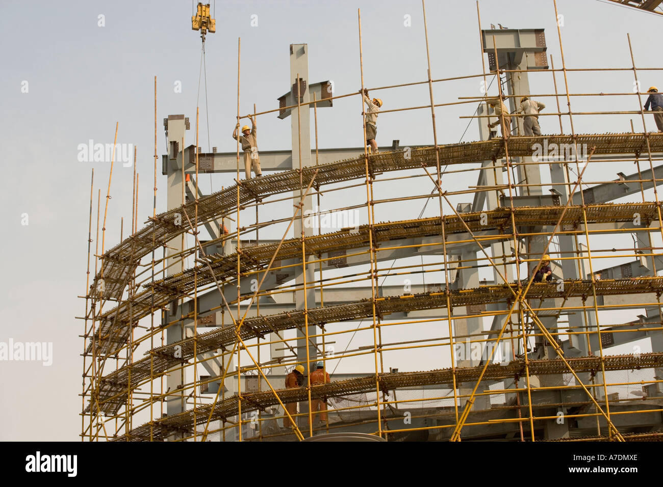 Asia China Shanghai Construction workers erect steel scaffolding at ...