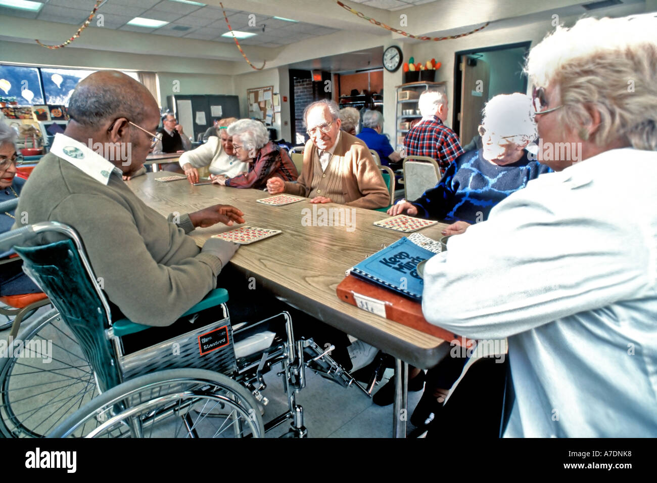 Disabled Seniors Playing Bingo At Adult Day Care Center Long Term disabled-seniors-playing-bingo-at-adult-day-care-center-long-term