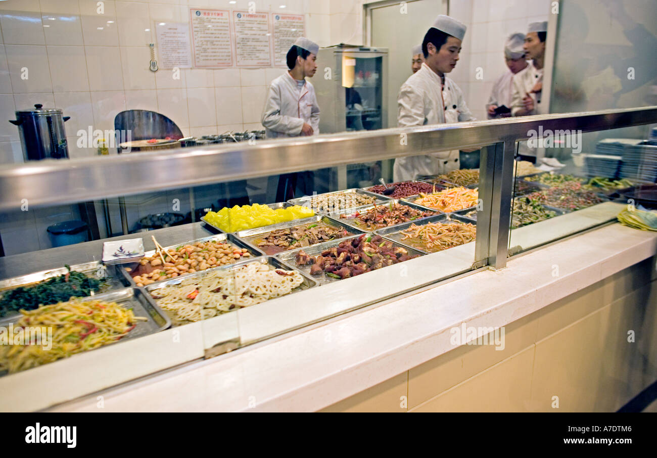 CHINA XI'AN Chinese customers select from food on display at restaurant ...