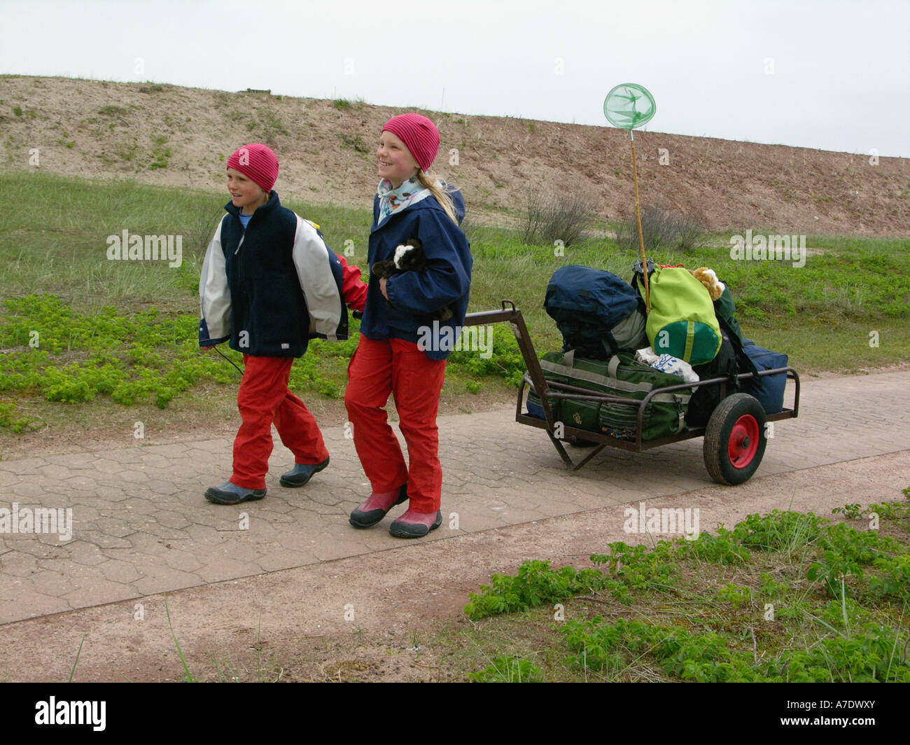 Pulling hand cart hi-res stock photography and images - Alamy