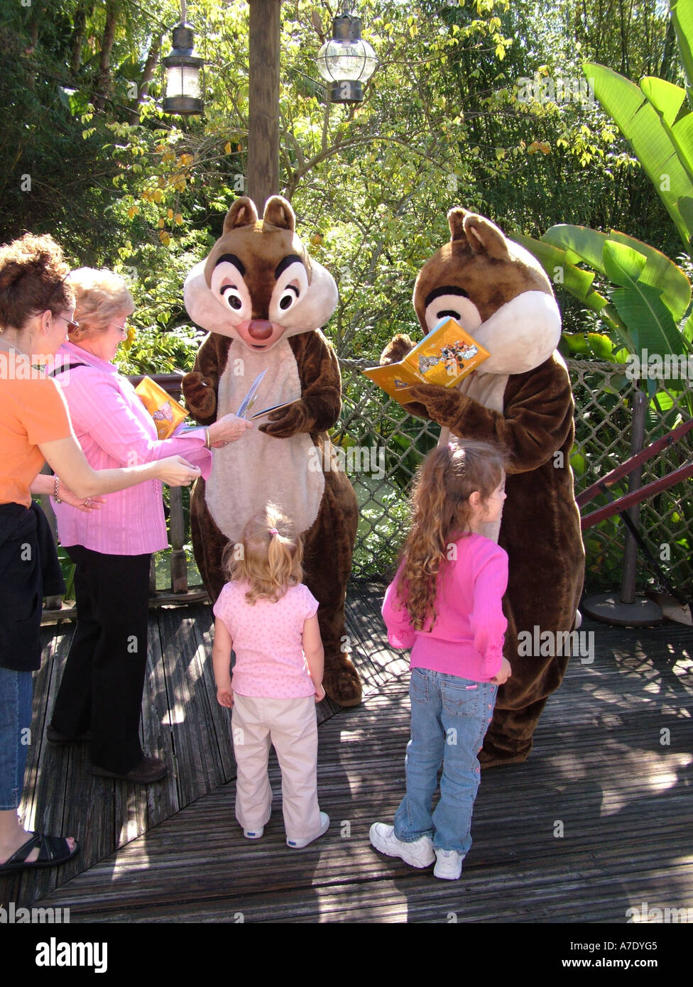 Disney world characters with kids hi-res stock photography and images ...
