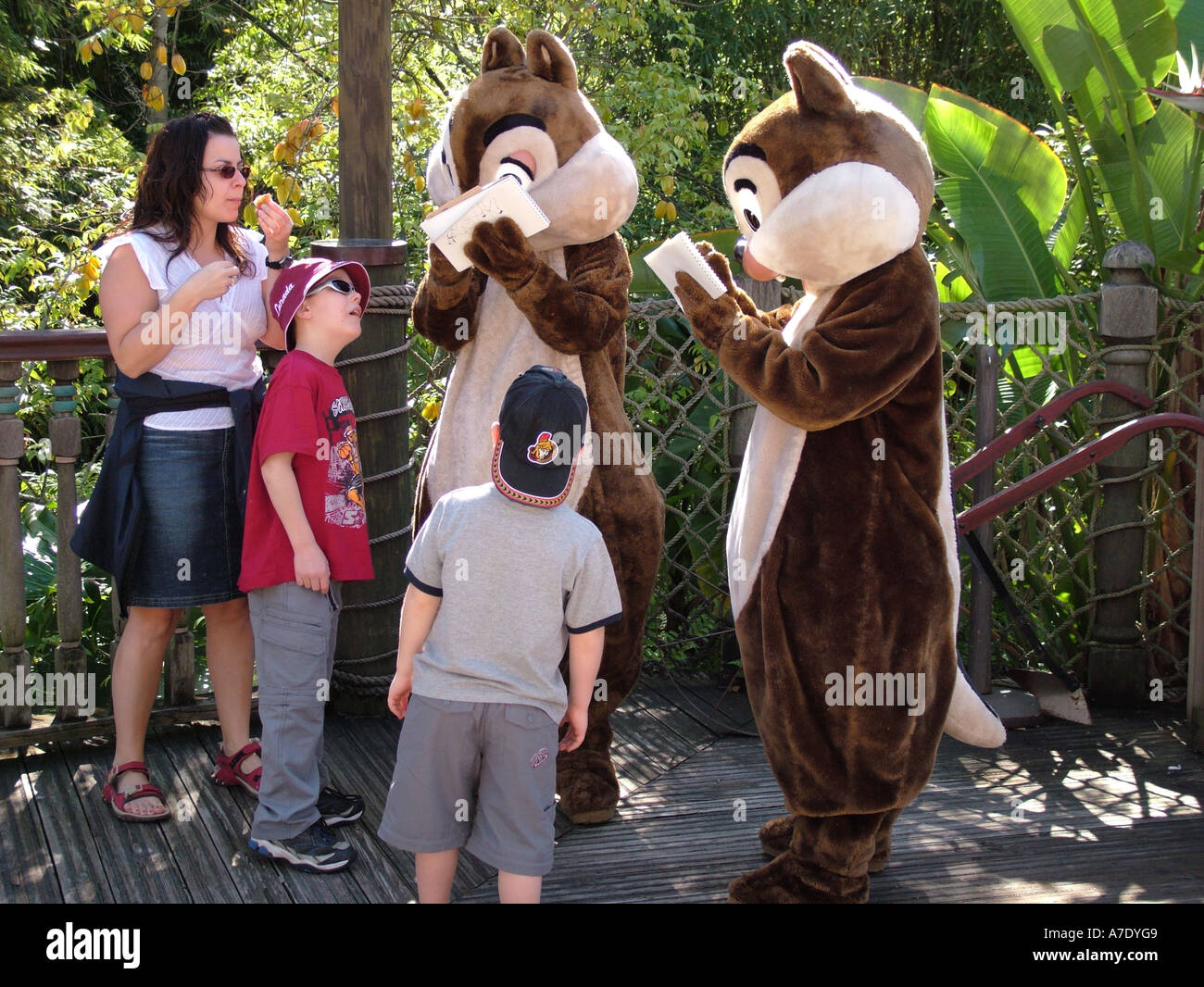 Disney world characters with kids hi-res stock photography and images ...