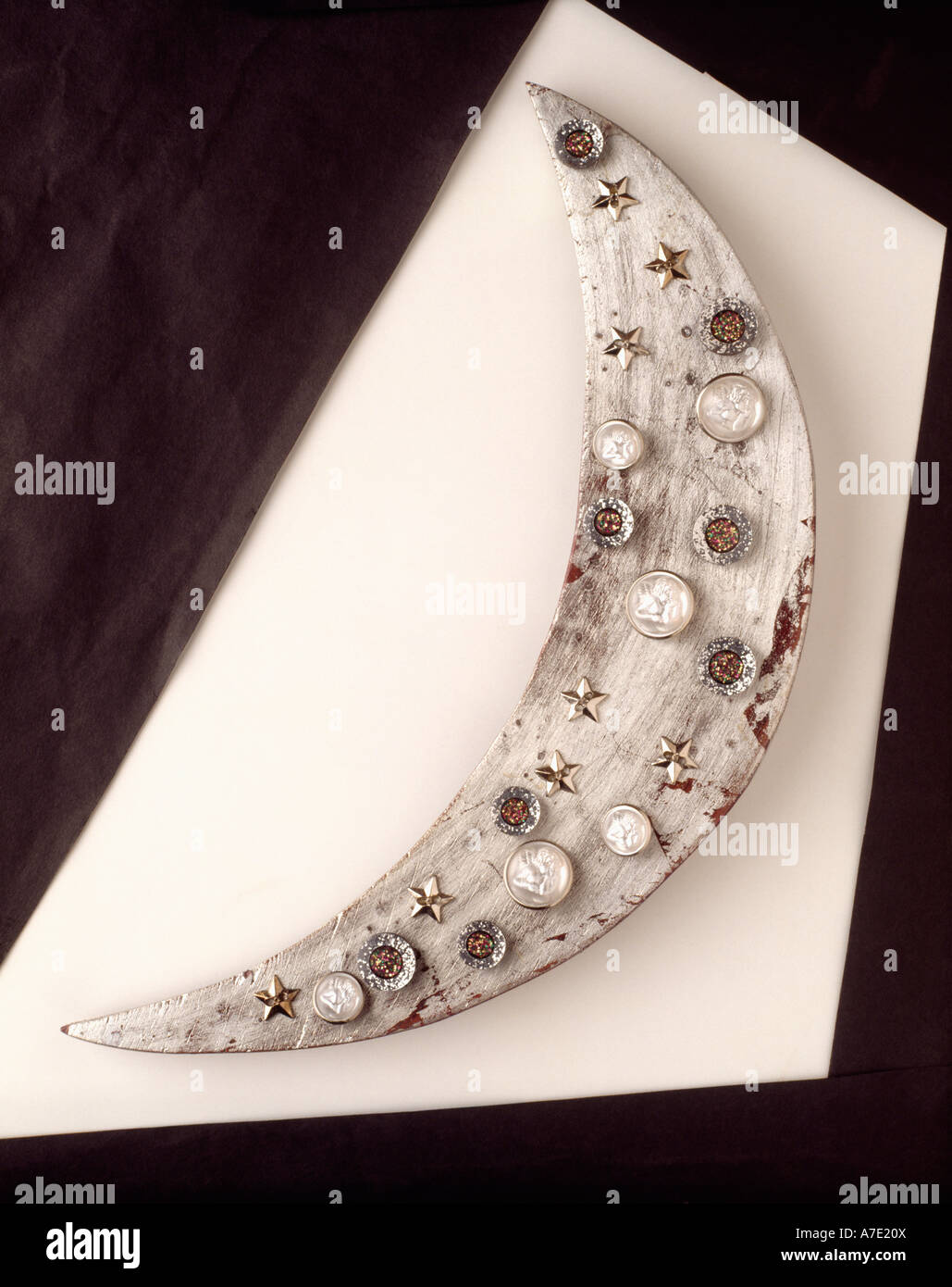 Close-up of wooden silver crescent moon decorated with buttons Stock ...