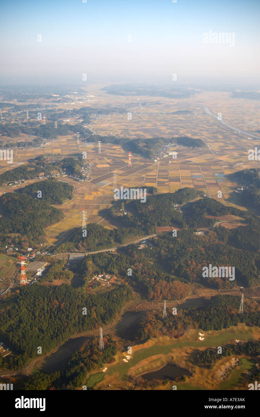 High level oblique aerial view of electricity transmission pylons ...