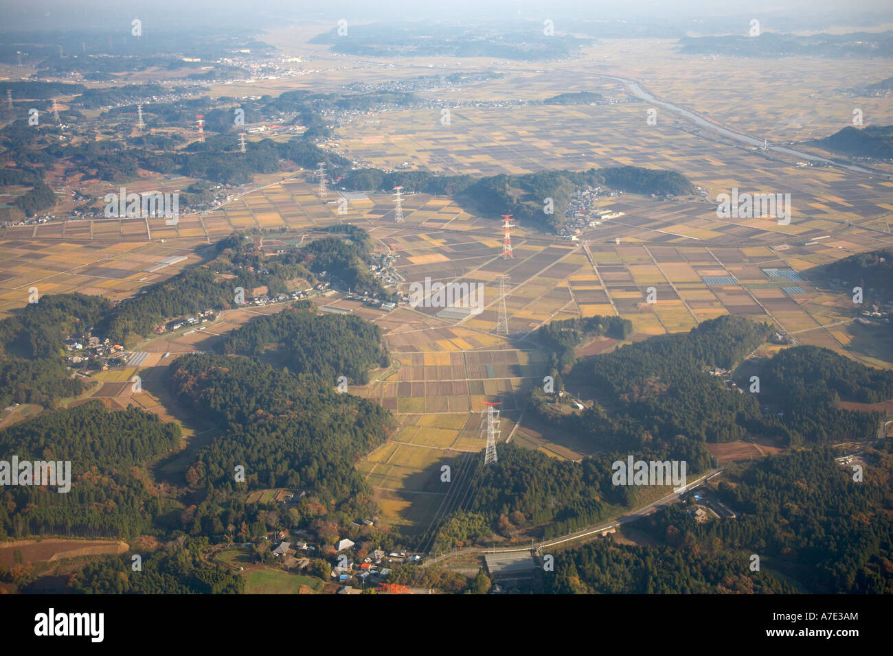 High level oblique aerial view of electricity transmission pylons ...
