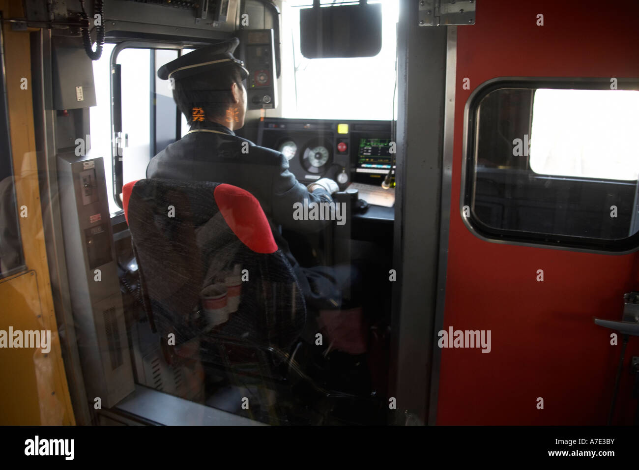 Driver in cab on JR Japan Railways Narita Express train Tokyo Japan ...