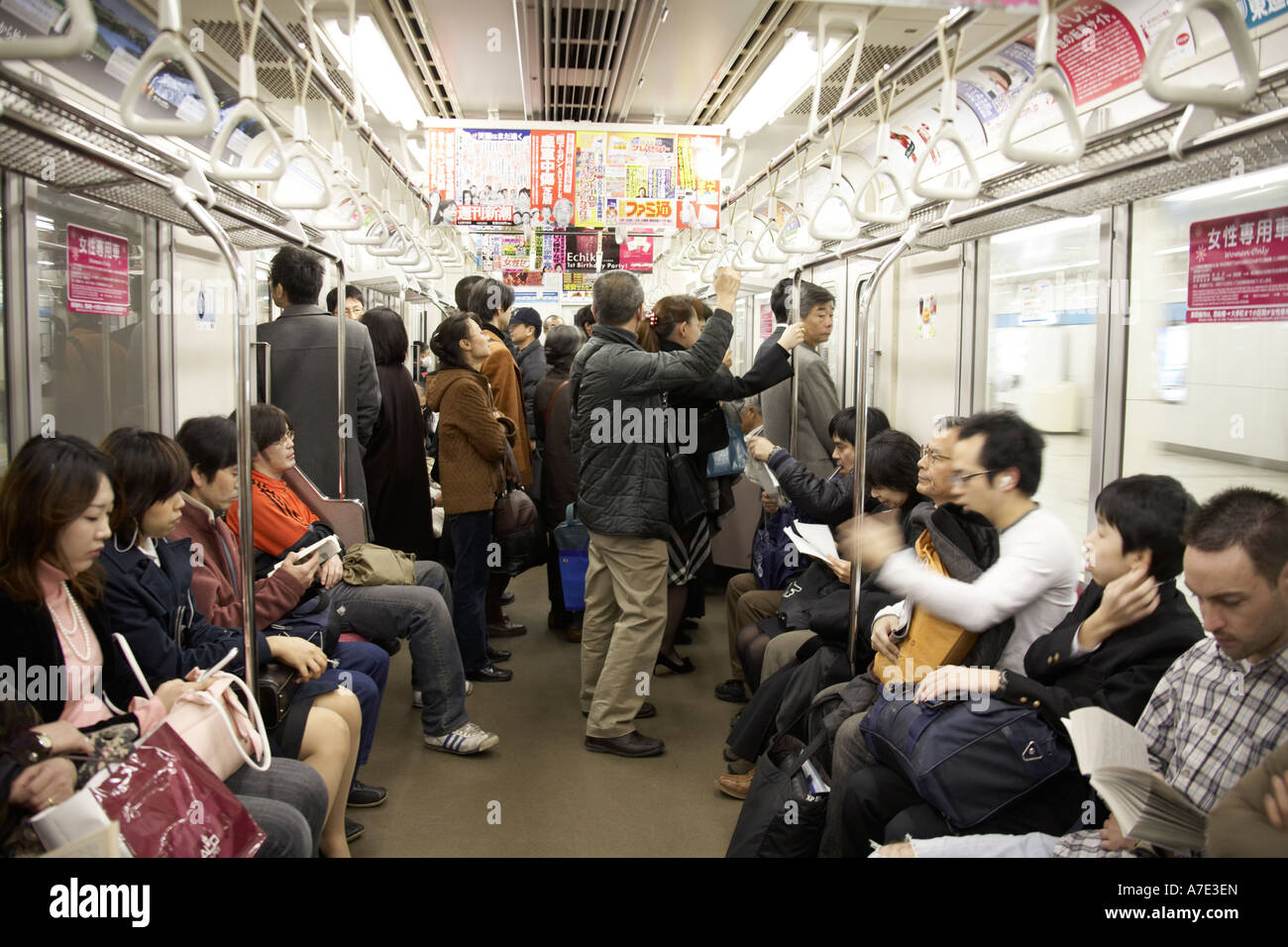 Passengers on underground Subway train in city of Tokyo Japan Asia ...