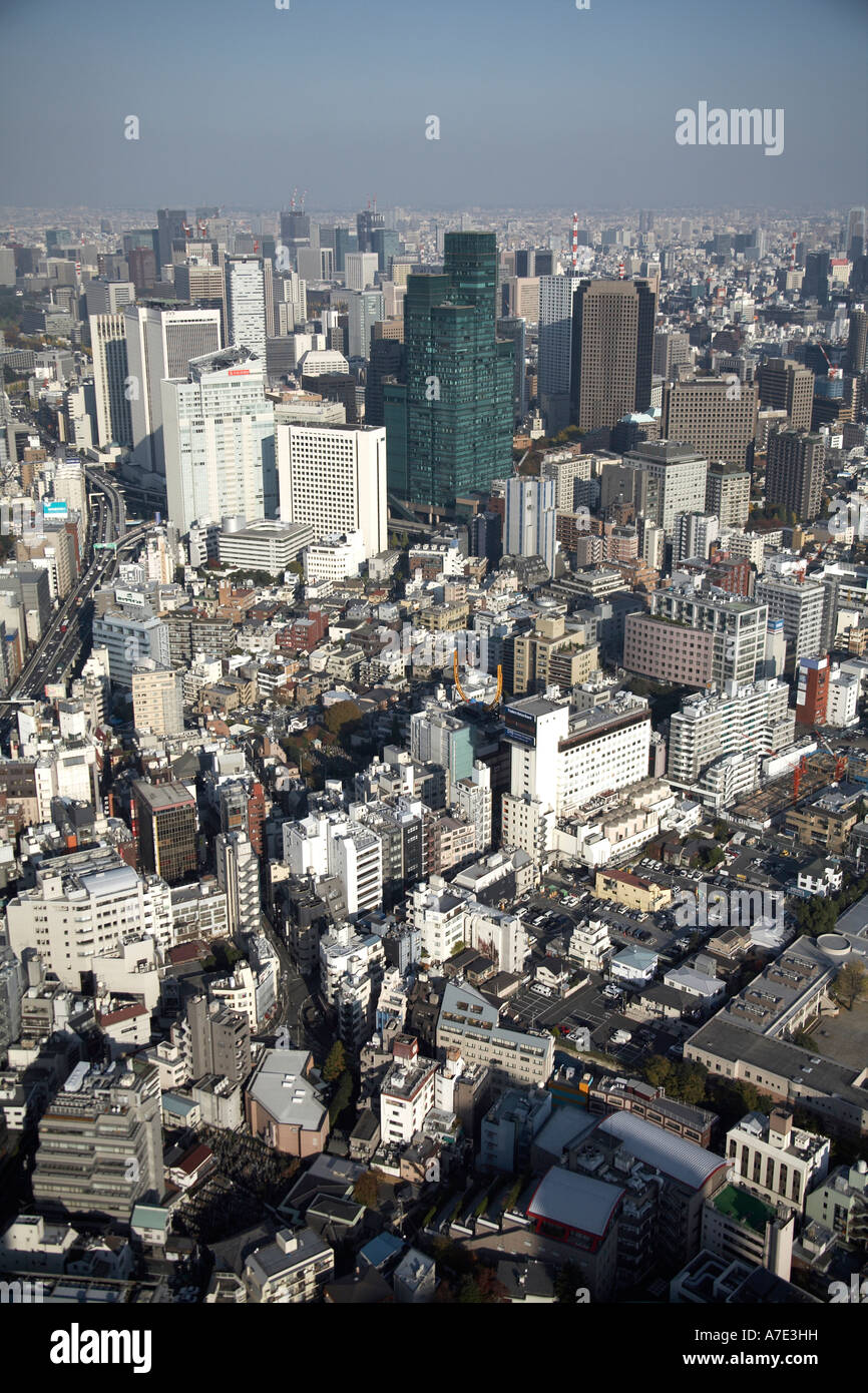 High level oblique aerial panorama east of office buildings from Tokyo ...