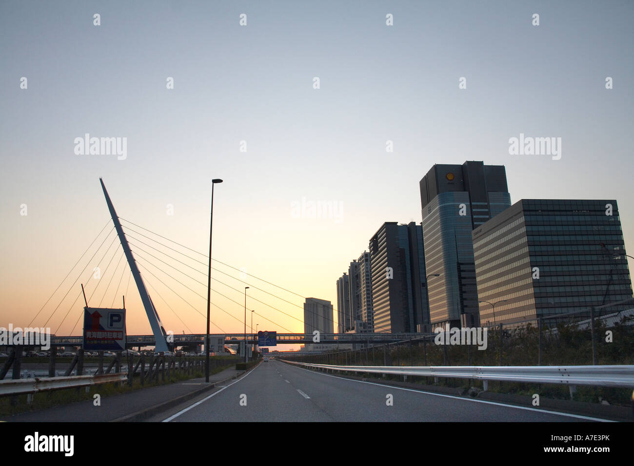 Buildings of Daiba with suspension bridge at dusk Daiba city of Tokyo ...