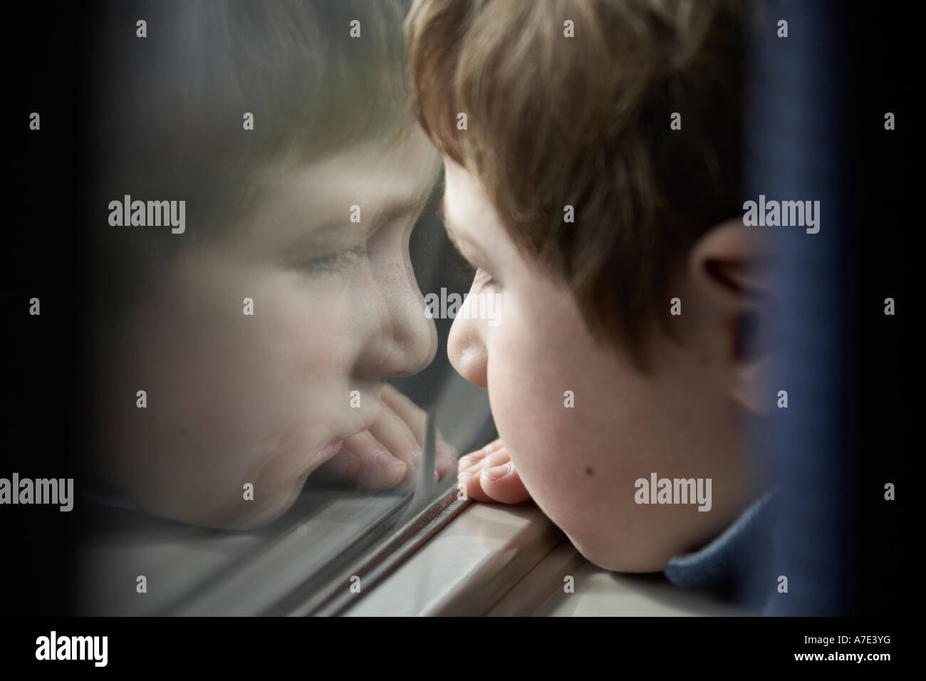 Young western boy looking out of Shinkansen or Bullet train window in ...
