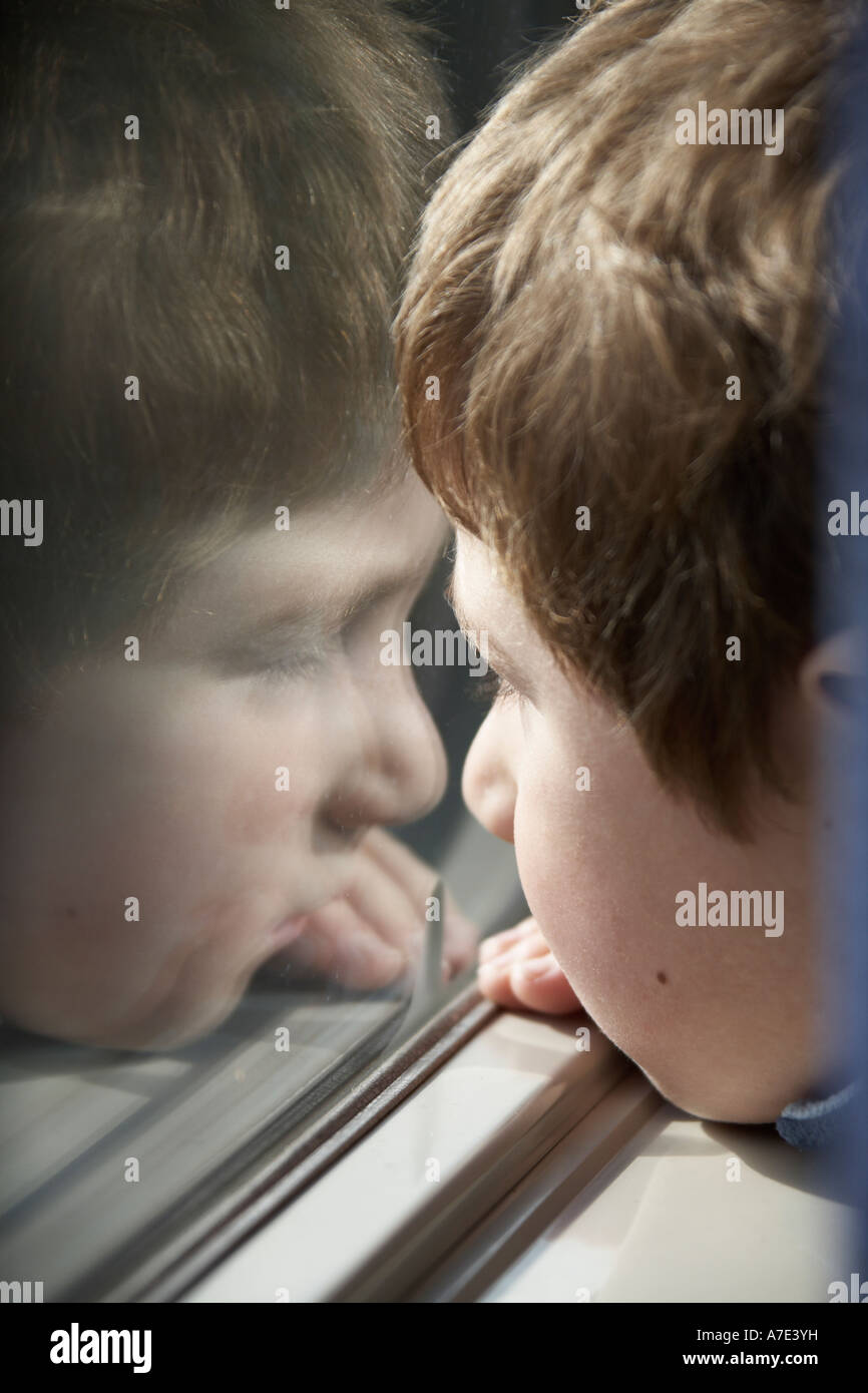 Young western boy looking out of Shinkansen or Bullet train window in ...