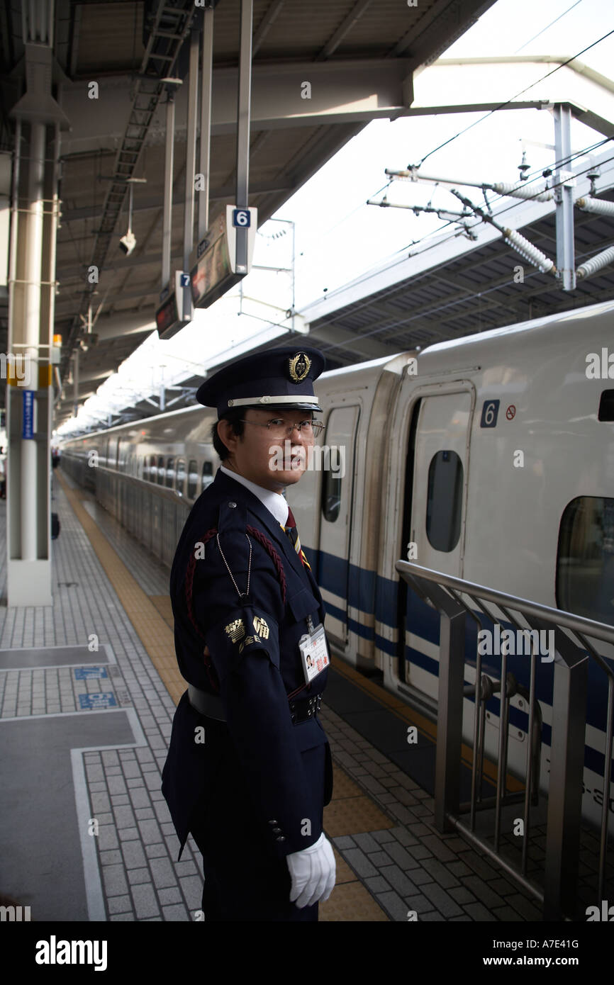 Japan Railways Shinkansen Super express Bullet train and platform guard ...