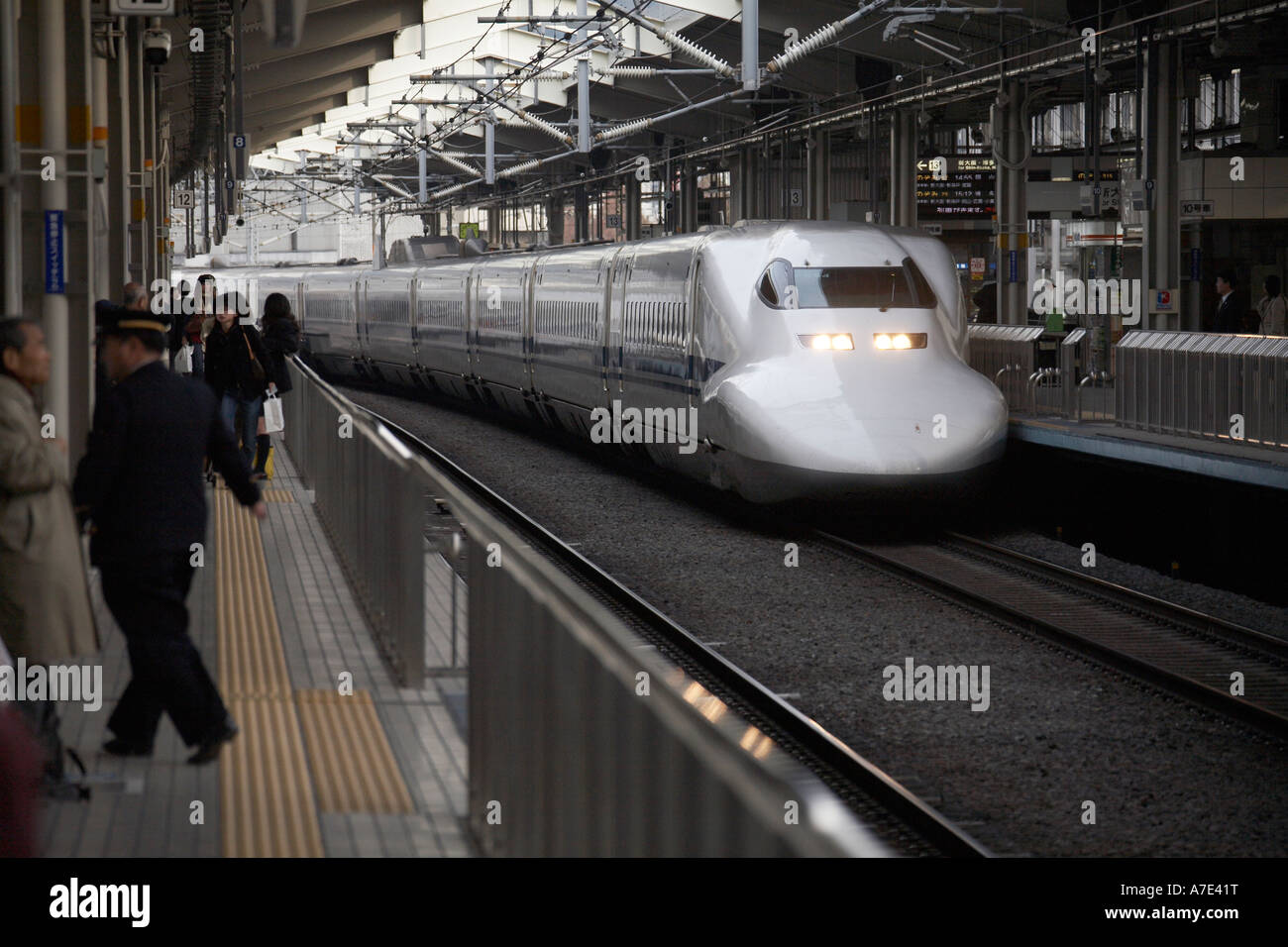 Japan Railways Shinkansen Super express Bullet train and pasengers in ...