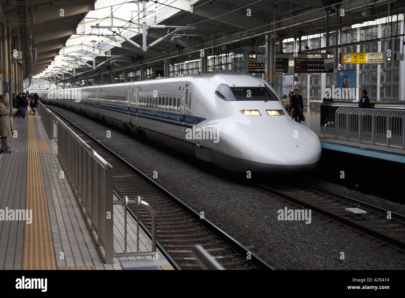 Japan Railways Shinkansen Super express Bullet train and pasengers in ...