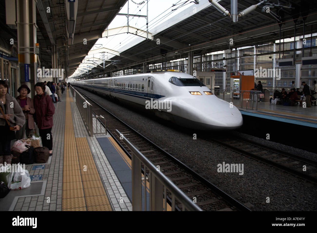 Japan Railways Shinkansen Super express Bullet train and pasengers in ...