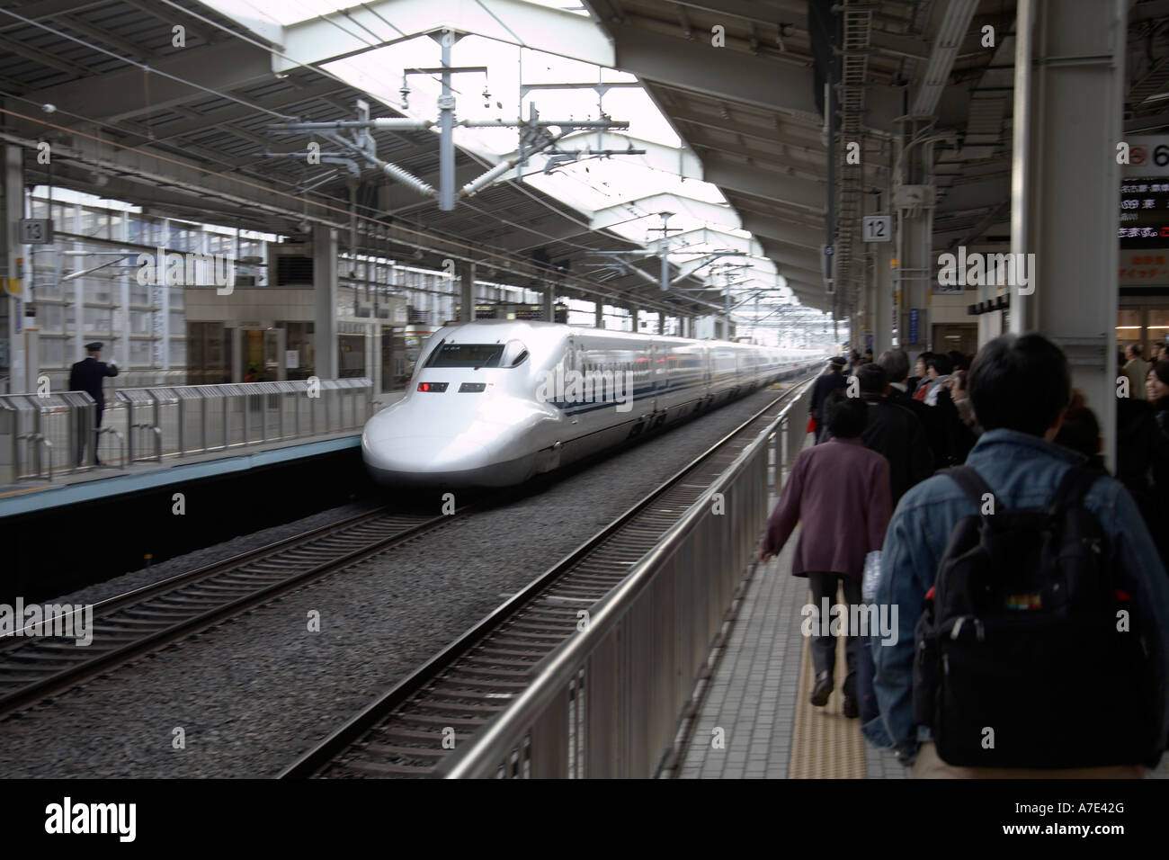 Japan Railways Shinkansen Super express Bullet train and pasengers in ...