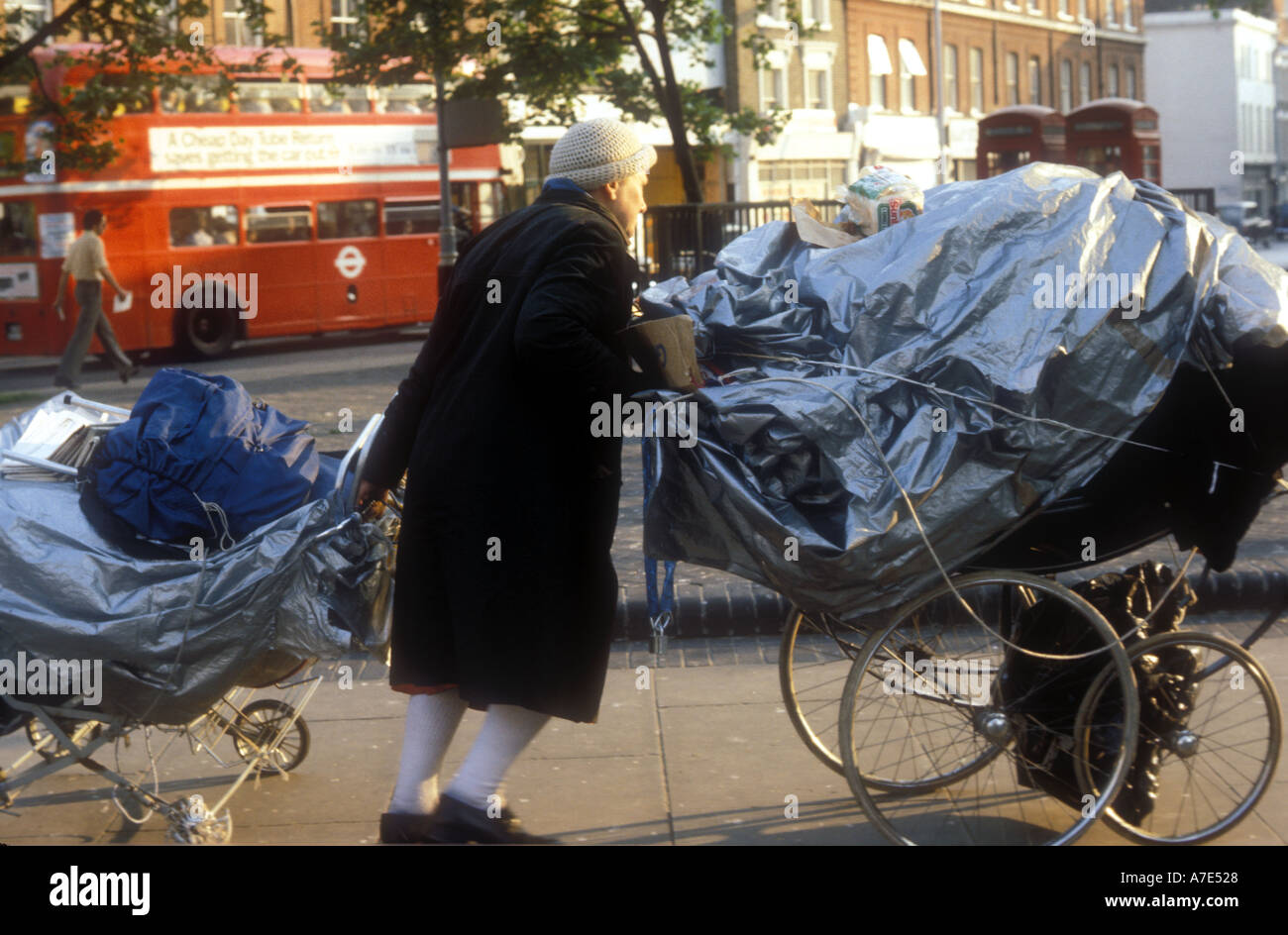 Homeless Woman Pushing Prams With Belongings Through Central London