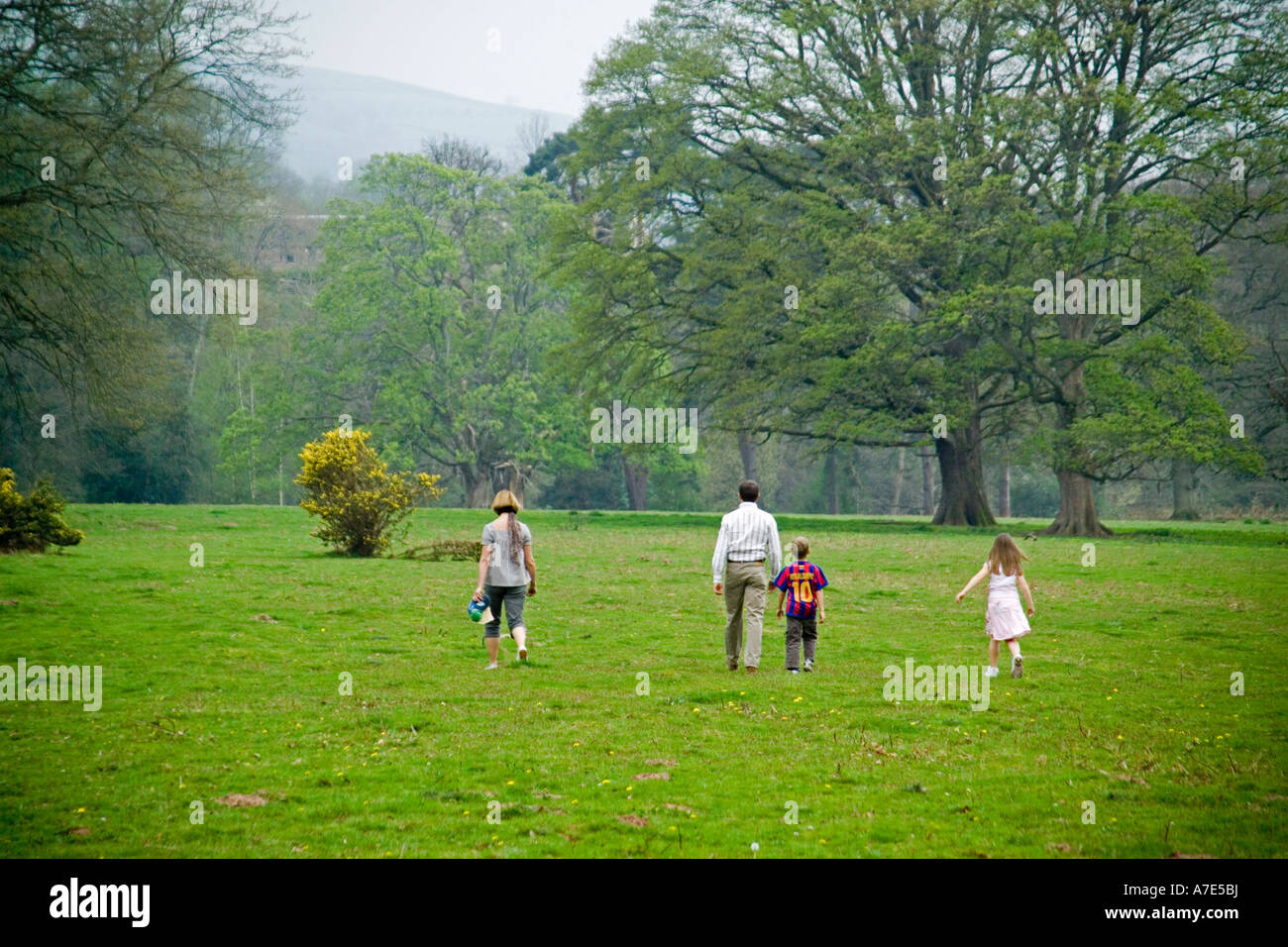 family strolling in the park Stock Photo - Alamy