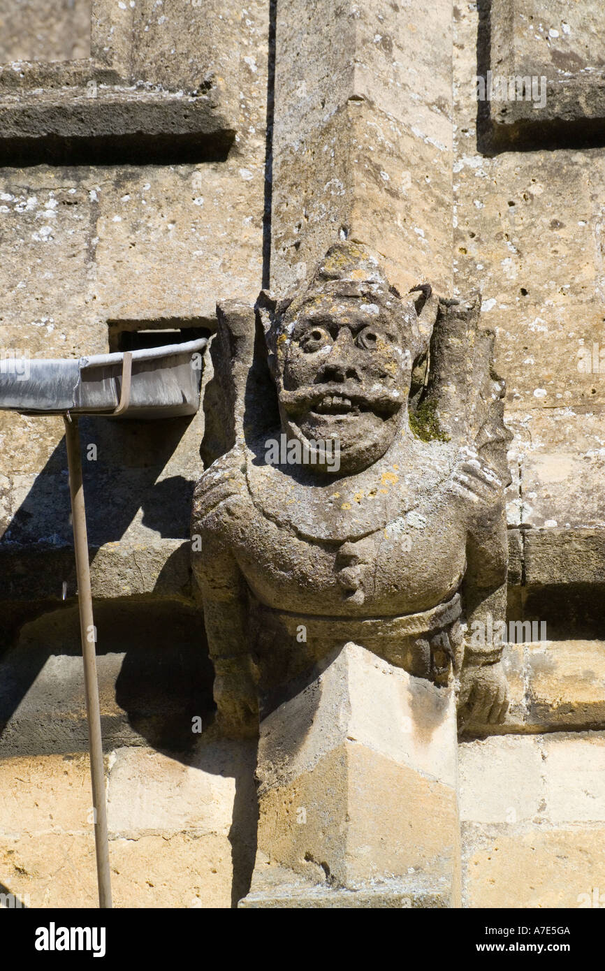 Medieval gargoyle on St Peters church (1465) in the Cotswold town of ...