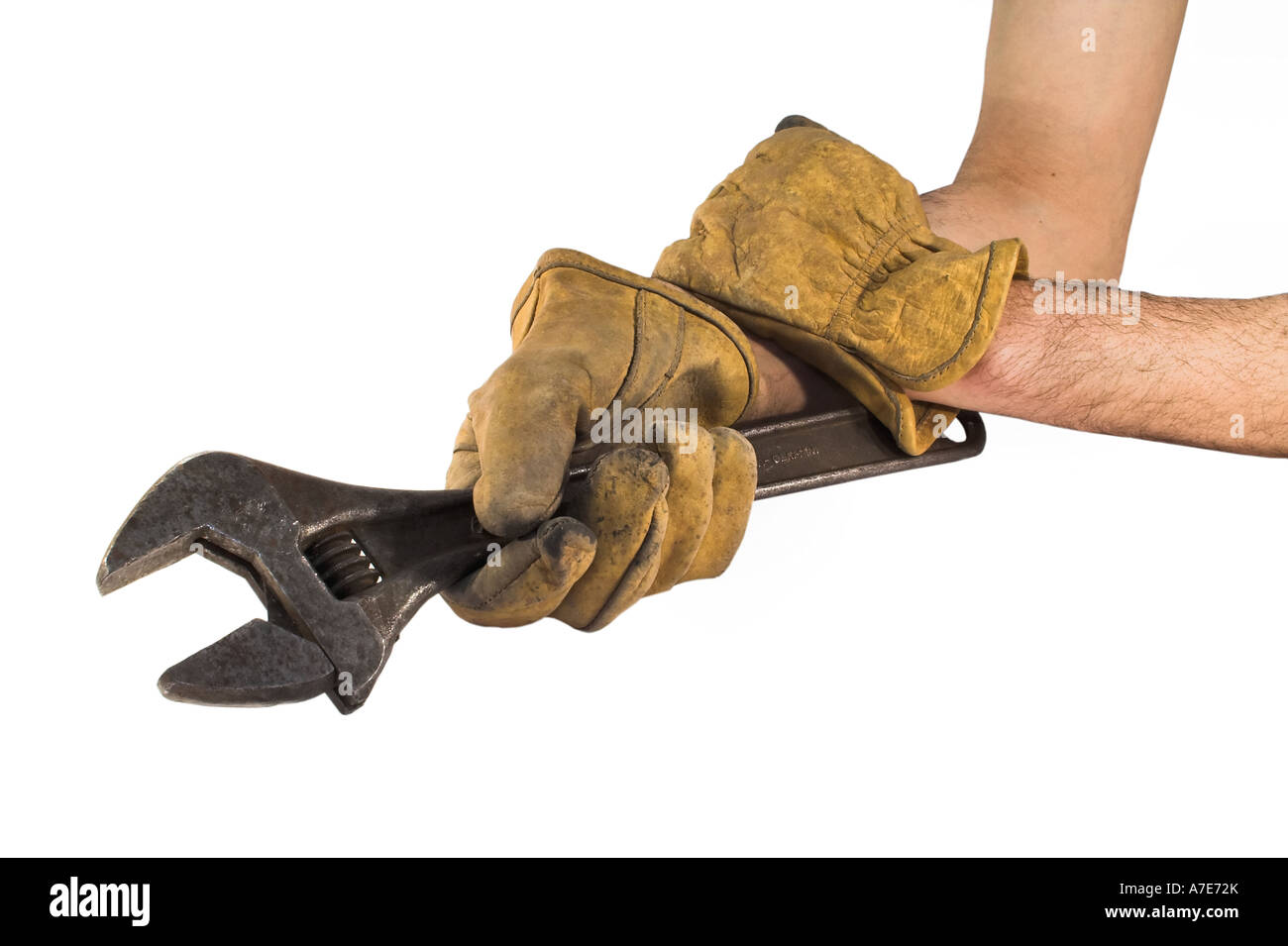 Man holding wrench with leather gloves Stock Photo - Alamy