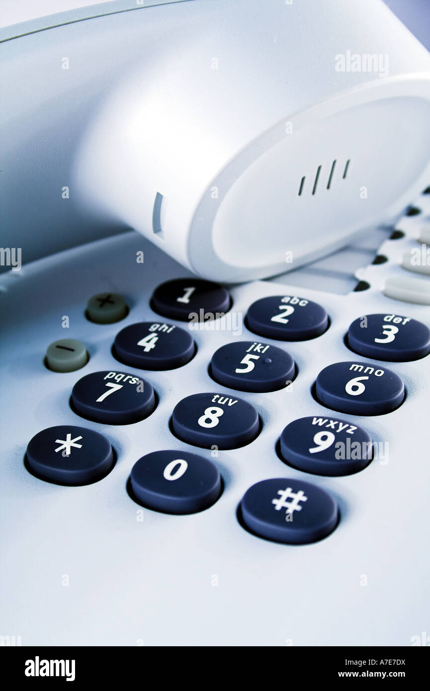 Office telephone. Detail of earpiece and keypad Stock Photo - Alamy