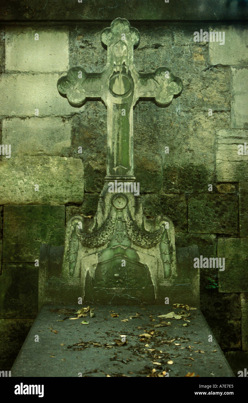 Tombstone cross in Parisian cemetery Stock Photo - Alamy