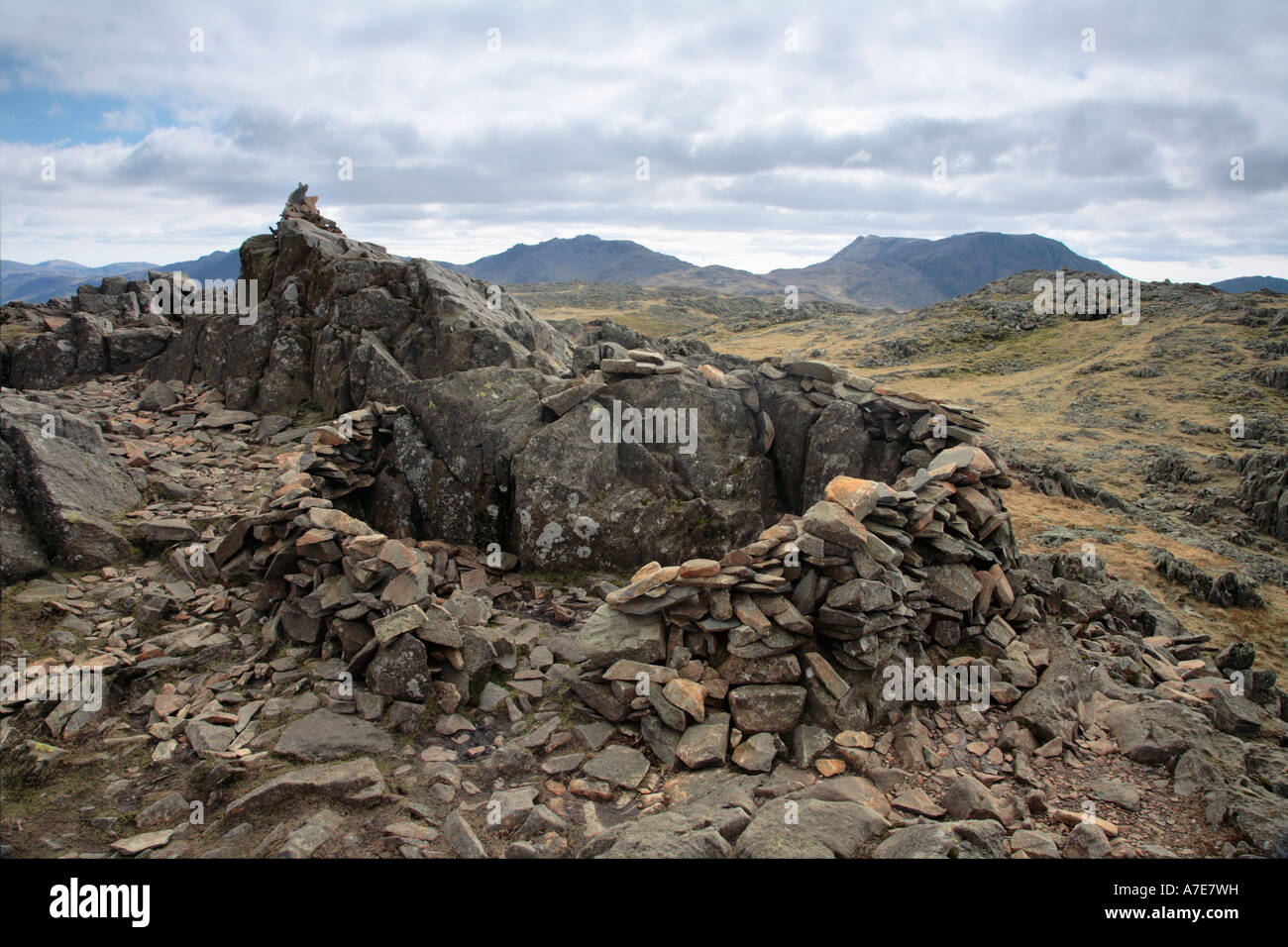 Stone built wind break at the summit of Glaramara Lake District ...