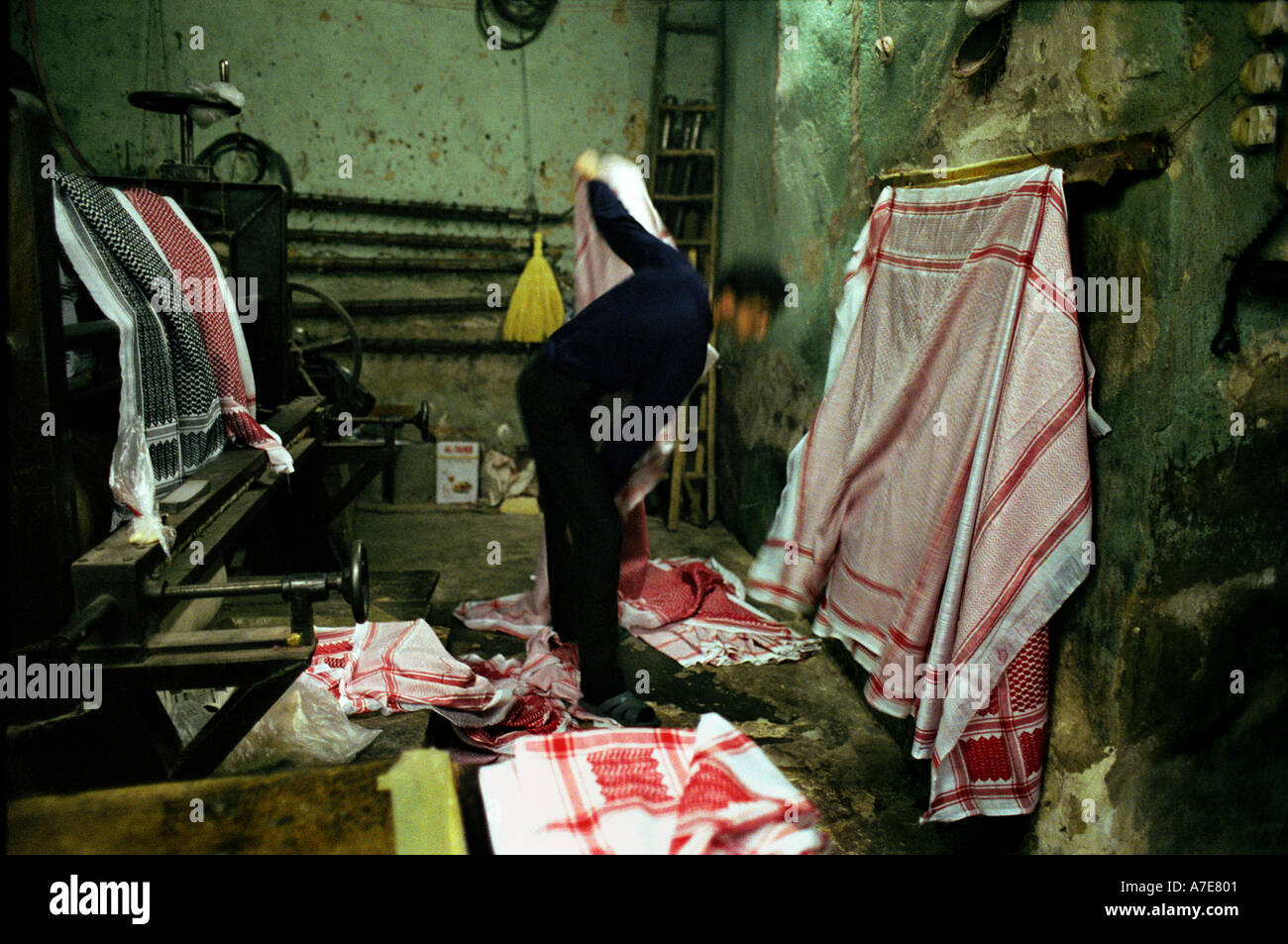 Factory making the traditional arab scarf the Keffayaa. Employee ...