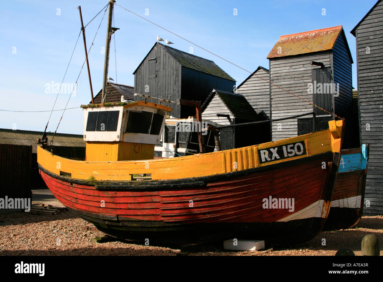 fishing boats on pebble beach at the stade or landing place hastings ...
