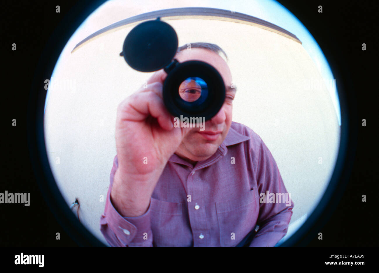 An Israeli engineer looking through an optical eyepiece device in ...