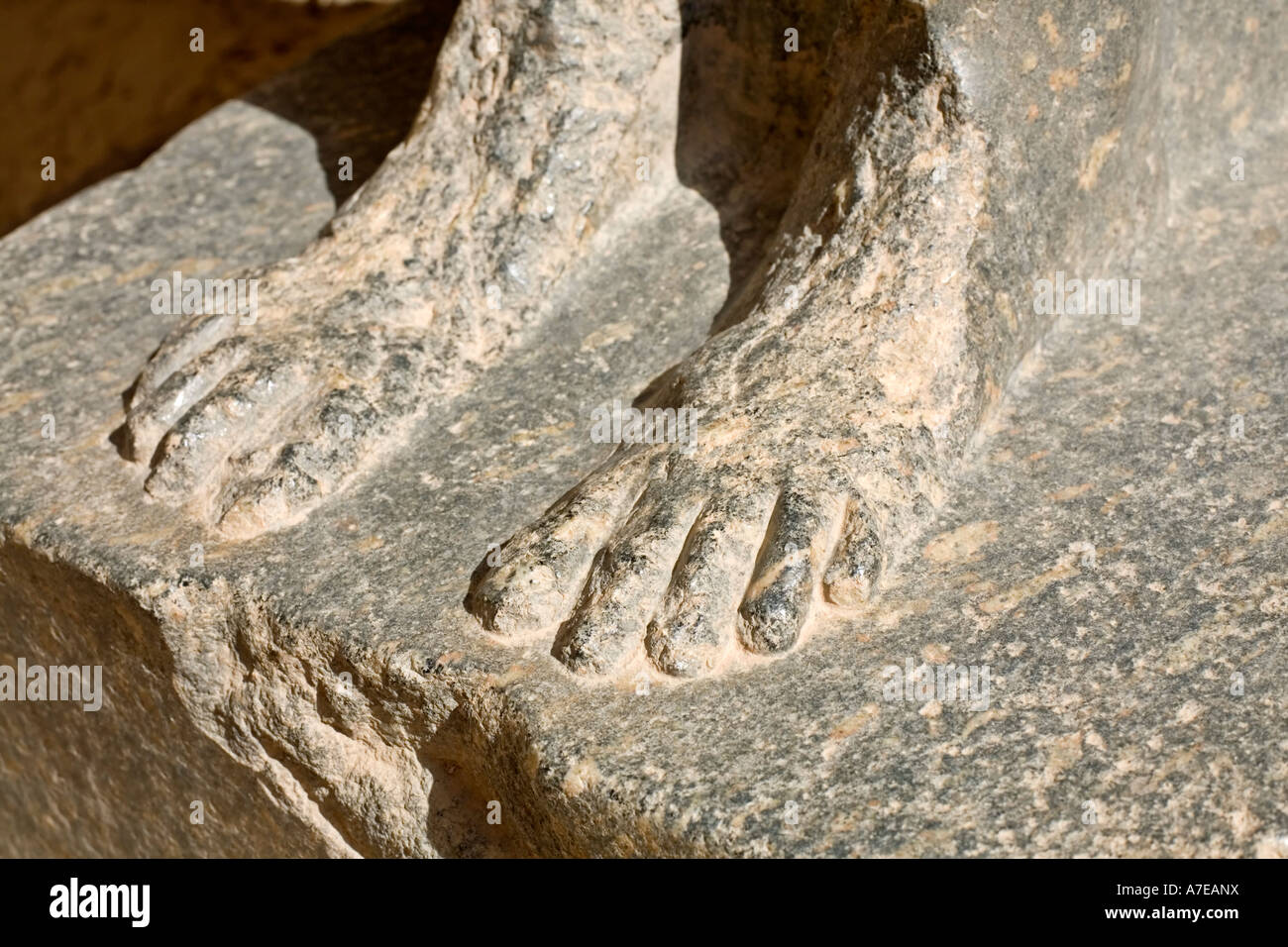 The well worn bare feet of a pharonic statue in the temple of Medinet ...
