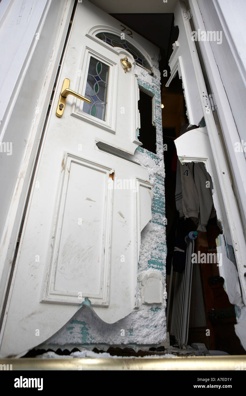 The remains of a front door after a police dawn raid on suspected drugs ...