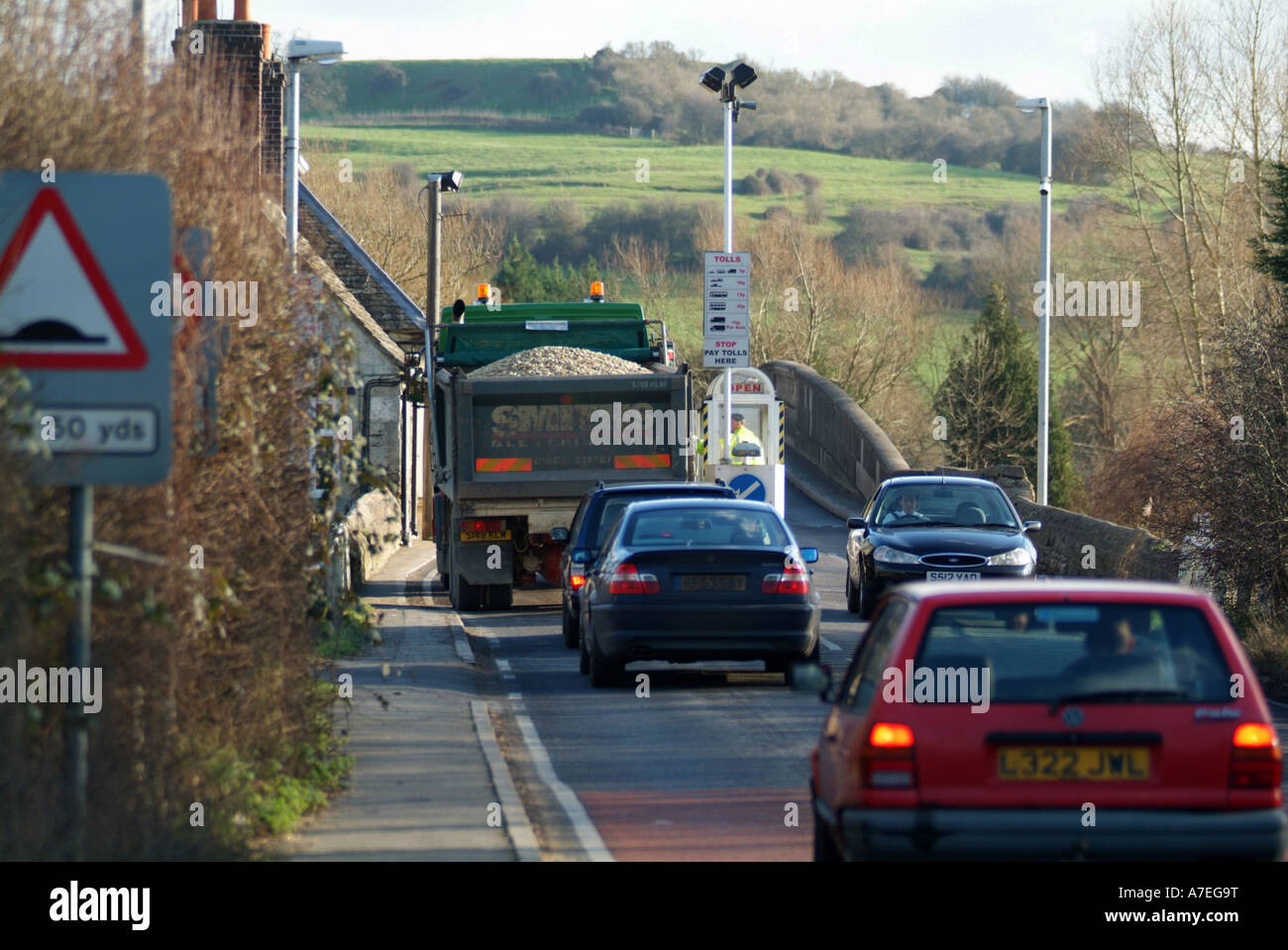 Traffic queuing to cross Swinford toll bridge over the Thames between ...