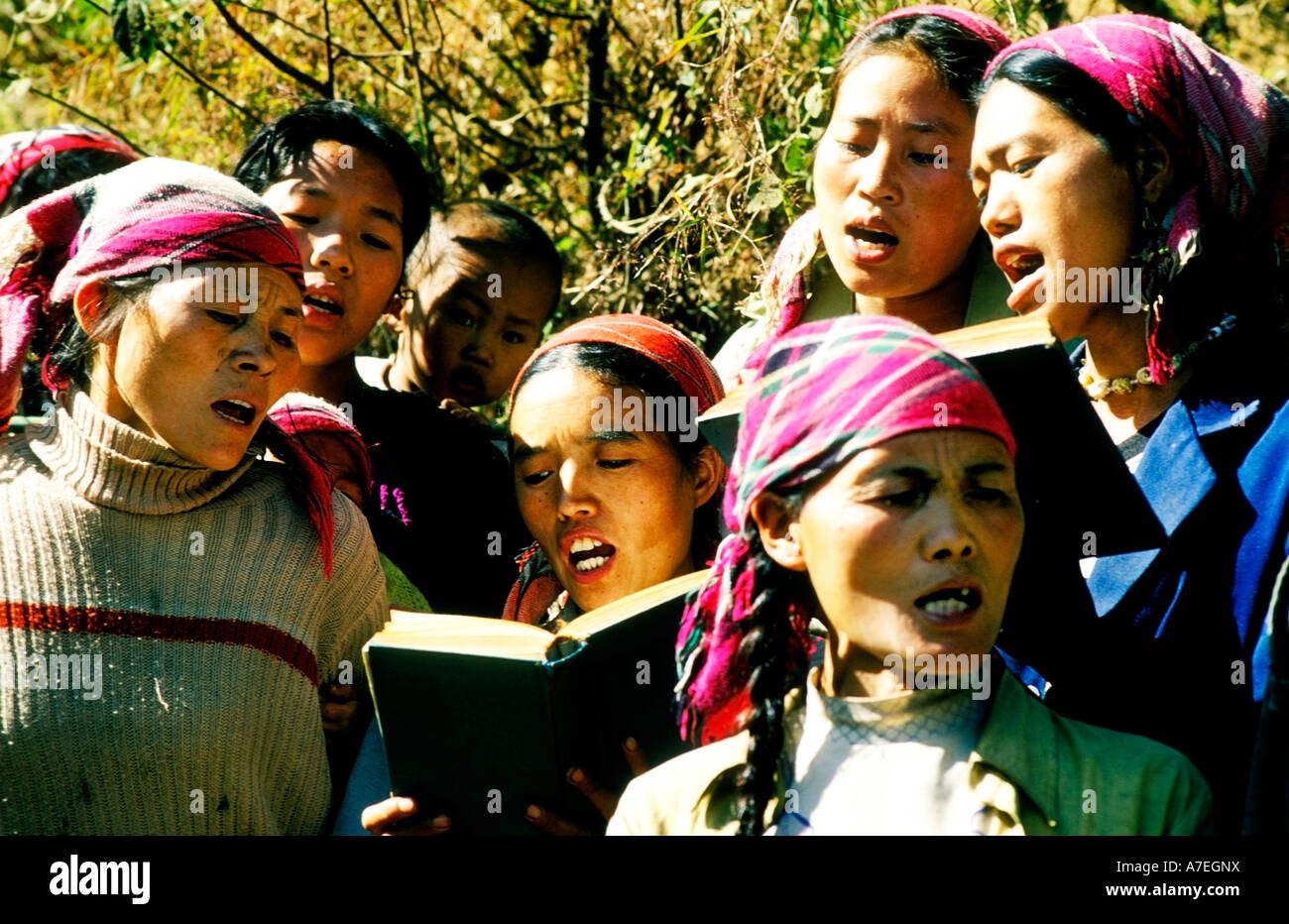 Asian people singing together outside Stock Photo - Alamy