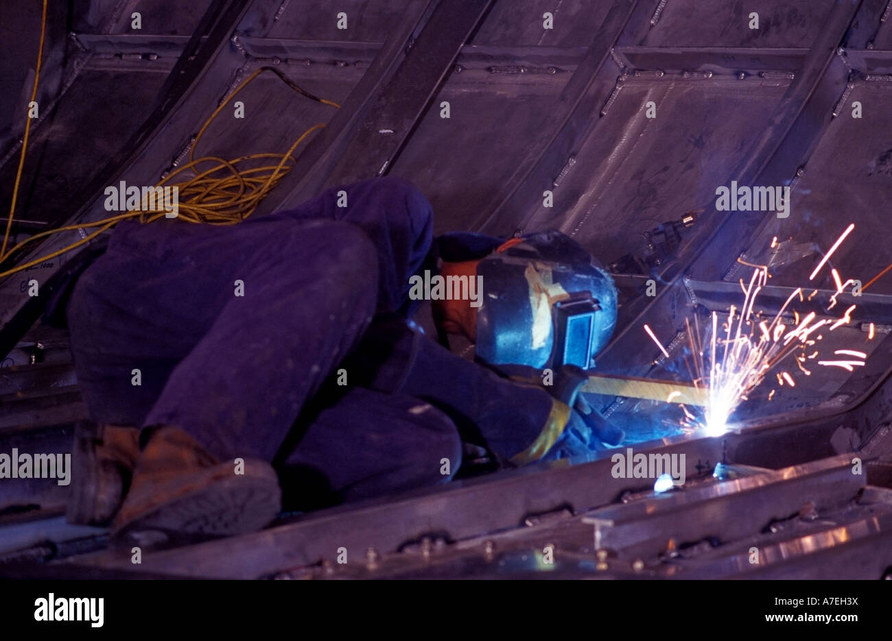 Aluminium welder wearing protective clothing working Stock Photo - Alamy