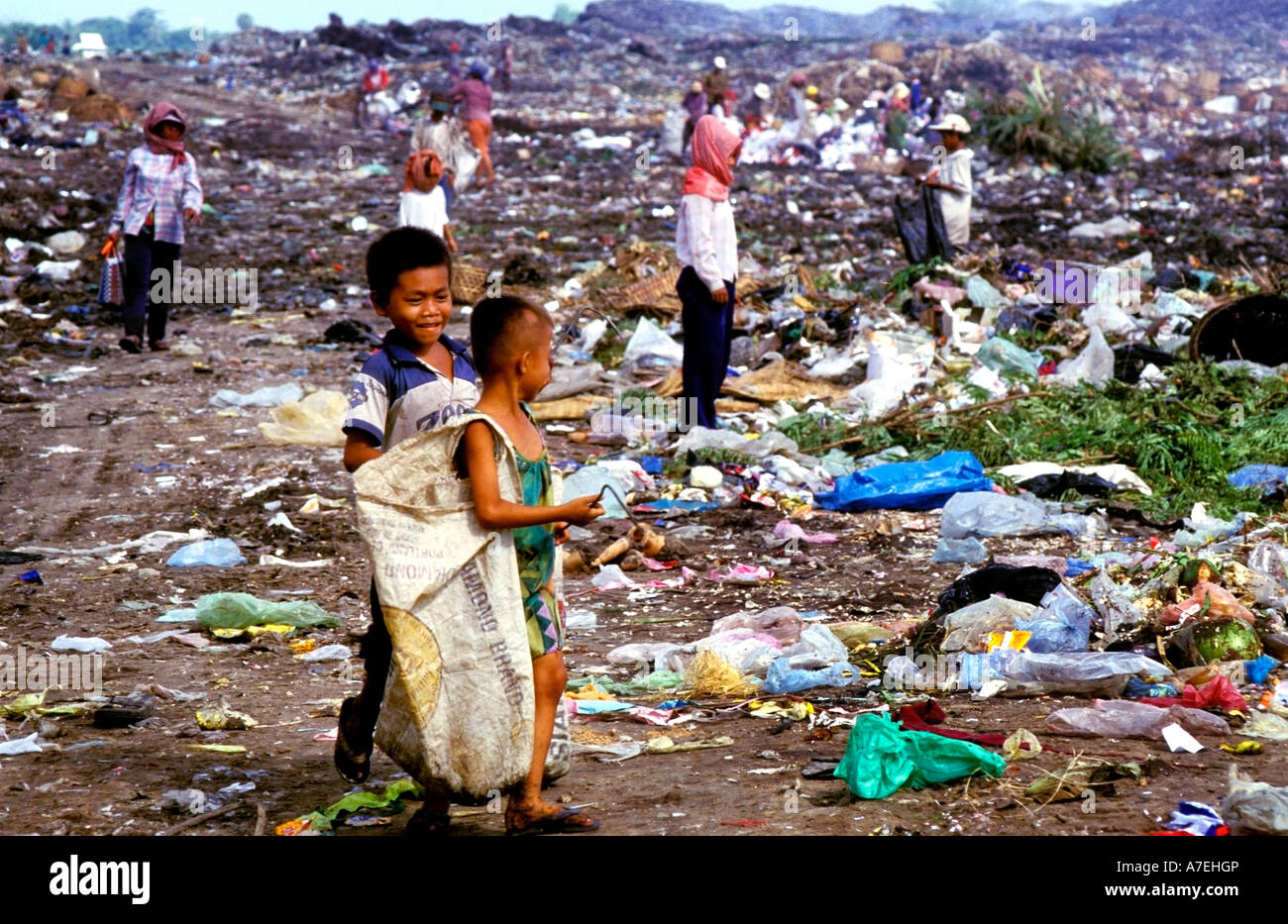 Chgildren scavenging through trash on Phnom Penh s Steung Meanchey ...