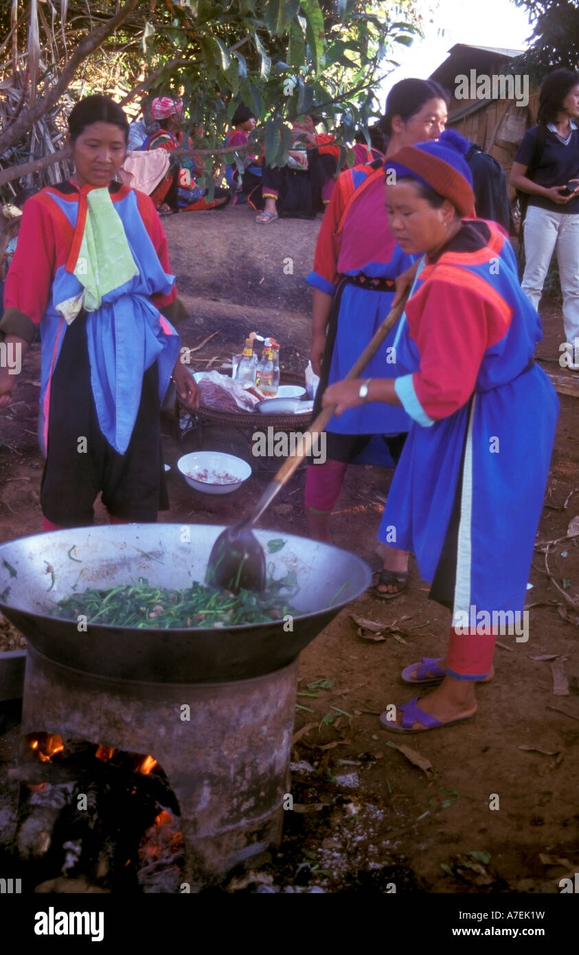 Traditionally dressed Lisu women preparing food at a gathering in ...
