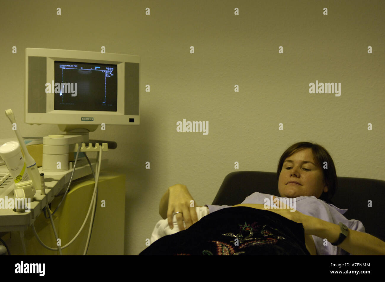 pregnant woman female montior screen maternity ante natal clinic ...