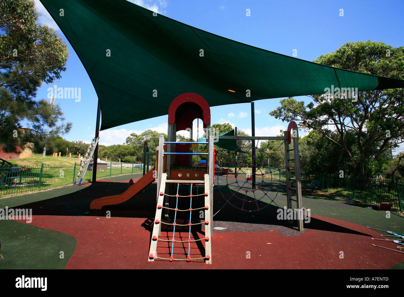 Childrens playground with sun protection screen Stock Photo - Alamy