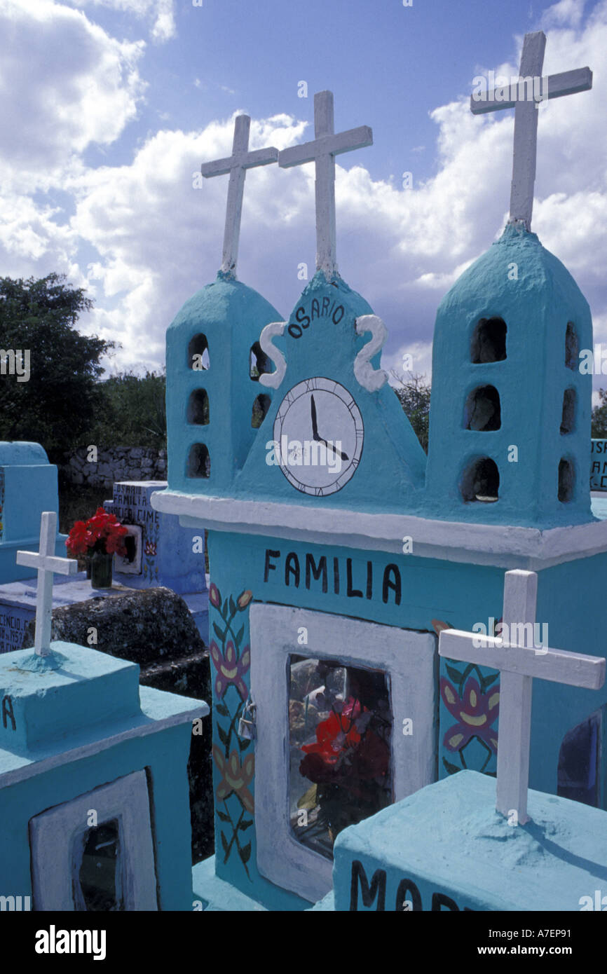 Mexico, Yucatan. Colorful cemetery with statues, crosses, and family ...