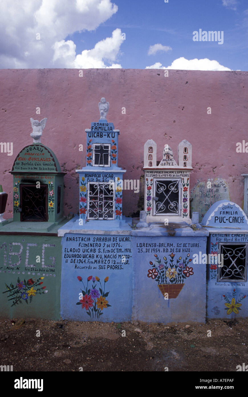 Mexico, Yucatan. Colorful cemetery with statues, paintings, graves ...