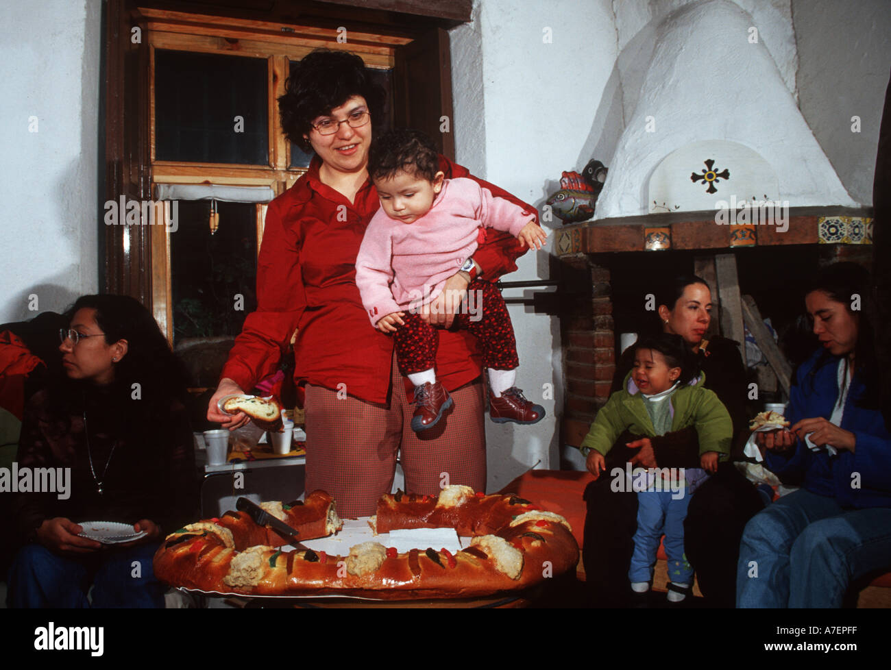 Mexico. Family celebrates The fiesta of the Rosca de Reyes or Ring of ...