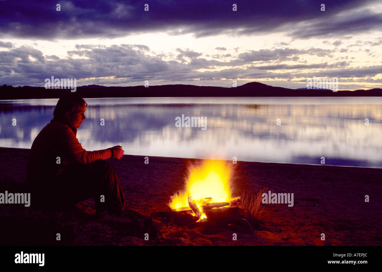 Sitting beside fire hi-res stock photography and images - Alamy